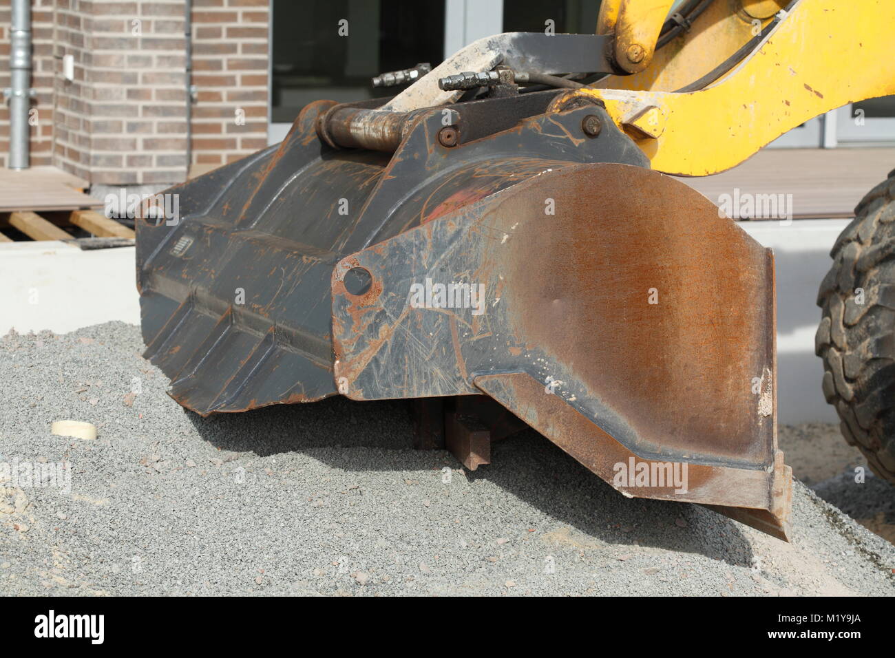 Excavator Bucket on a Construction Site with earth Stock Photo - Alamy