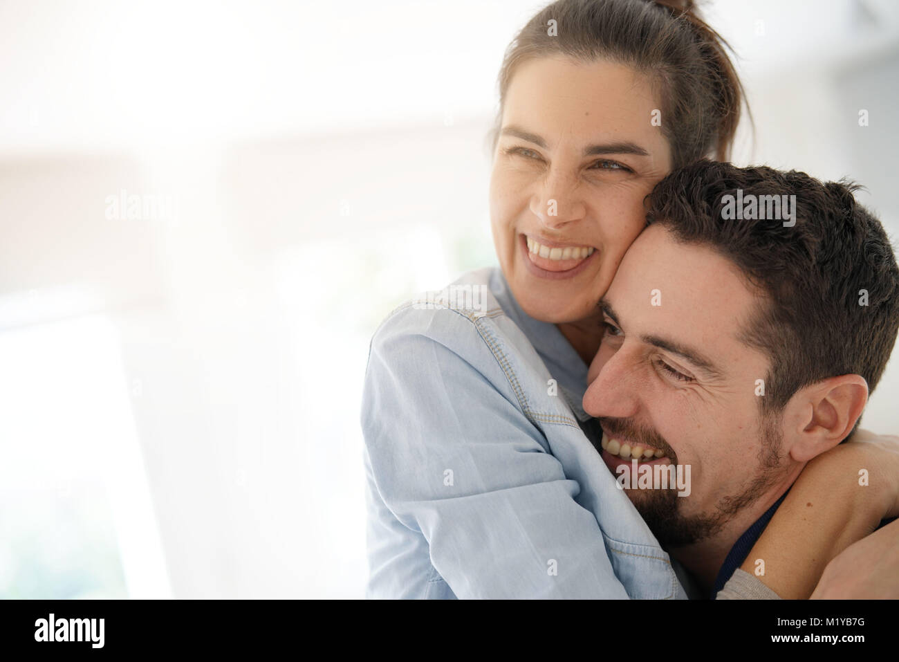 Cheerful romantic couple of lovers cuddling Stock Photo - Alamy