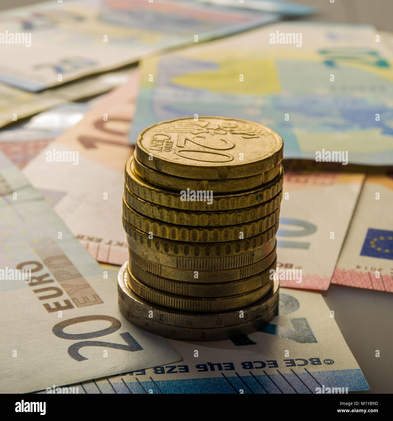 paper euro banknotes and coins. Currency of the European Union Stock ...