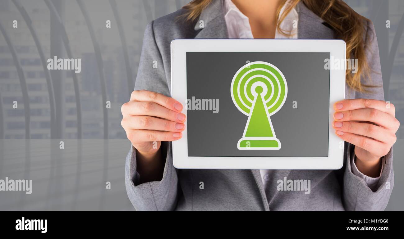 Hand holding tablet with signal icon Stock Photo - Alamy