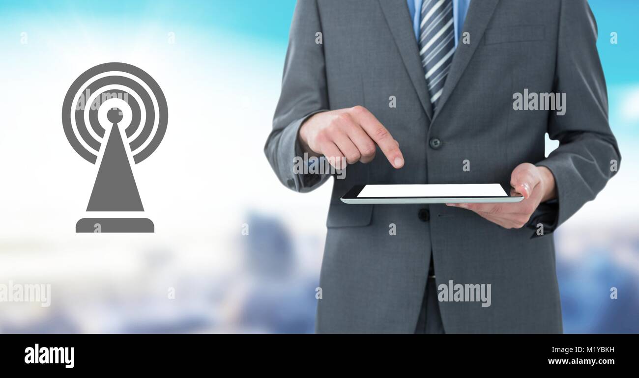 Hand holding tablet with signal icon Stock Photo - Alamy
