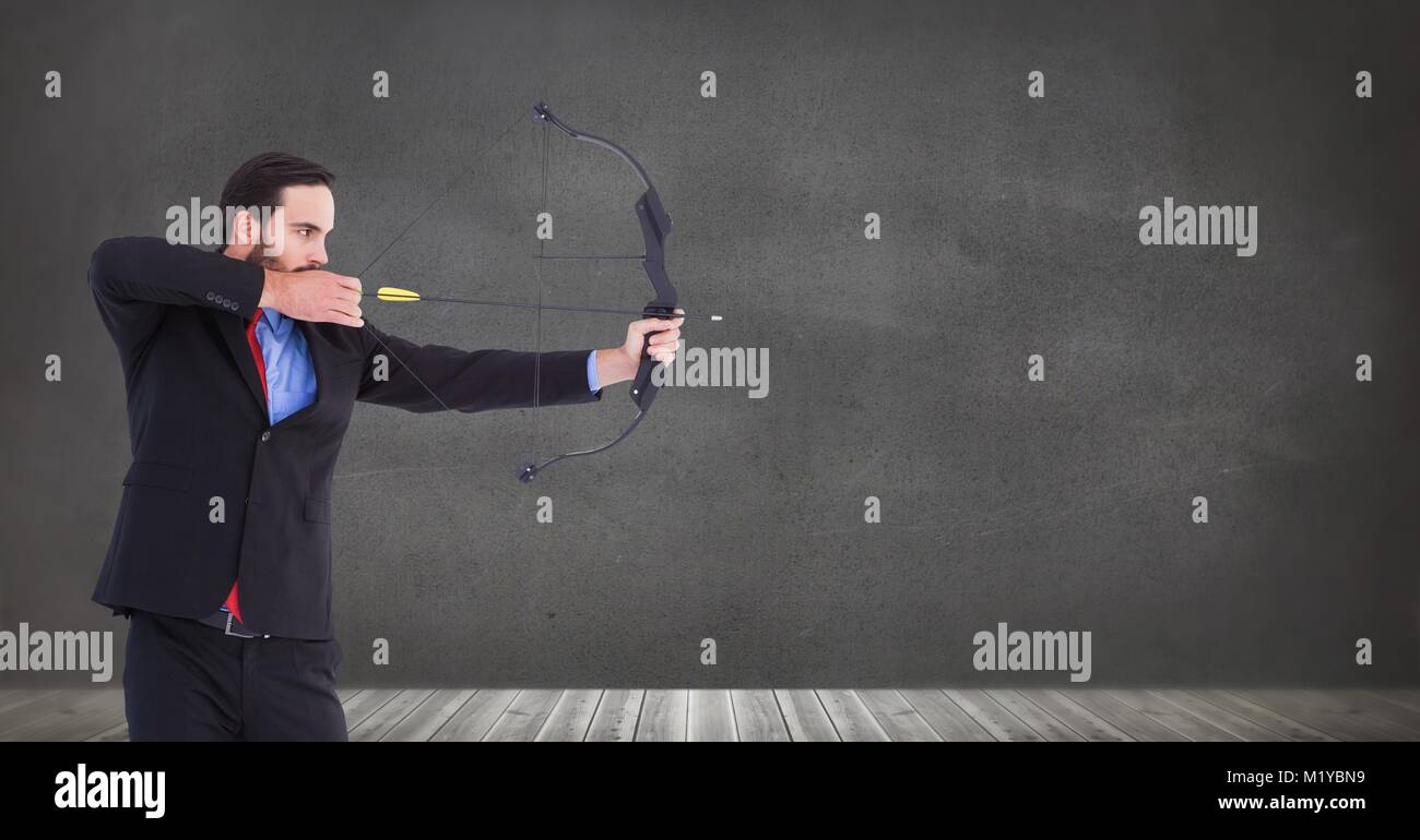 Businessman shooting arrow Stock Photo - Alamy