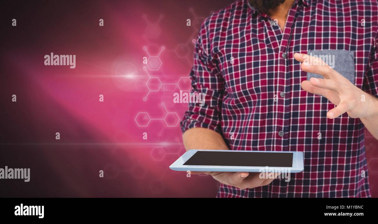 Hand holding tablet with Magenta background Stock Photo - Alamy
