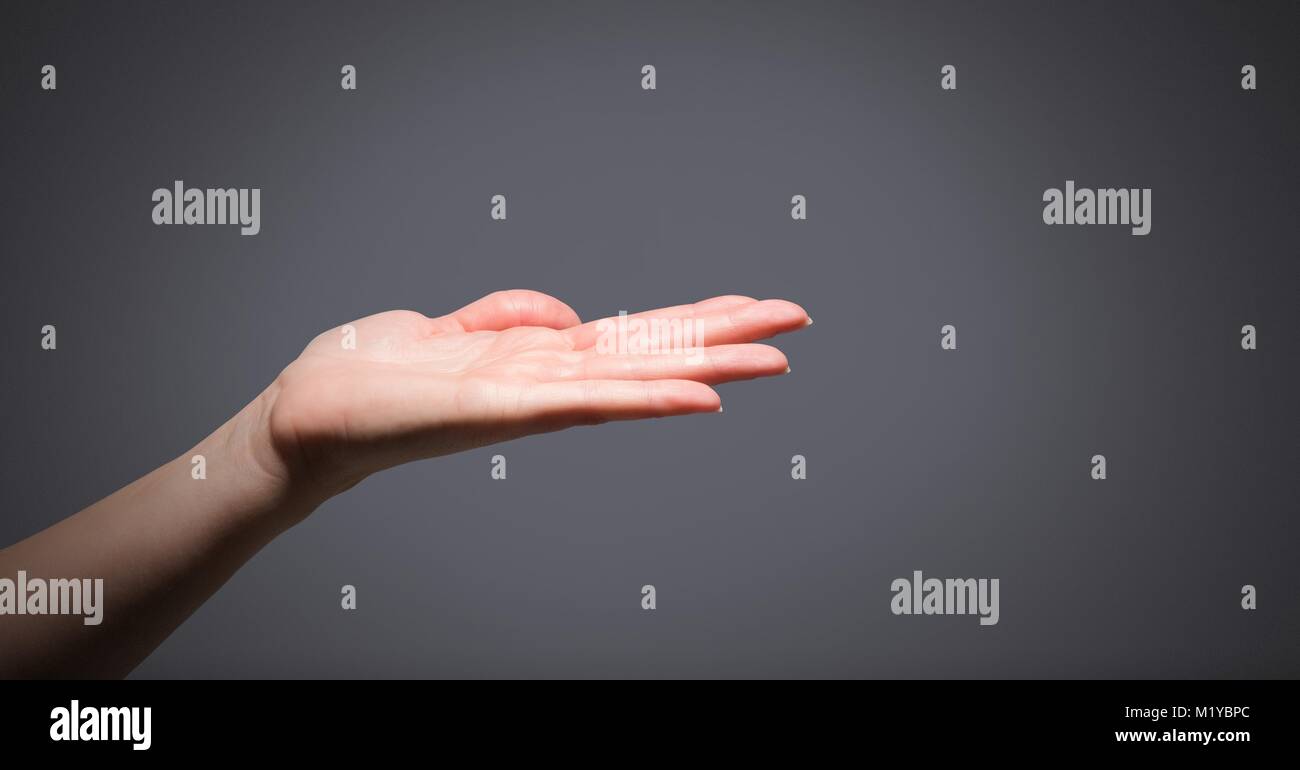Hand open with grey background Stock Photo - Alamy