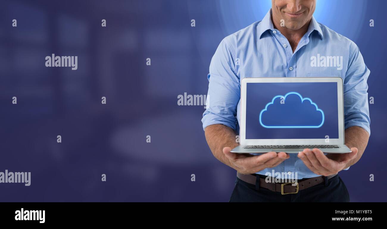 Hand holding laptop with cloud icon Stock Photo - Alamy