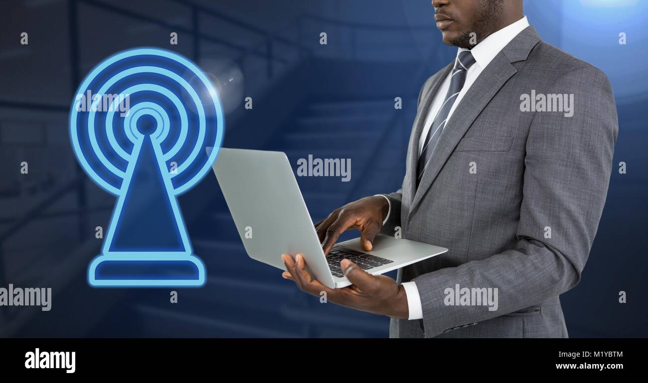Hands using laptop with signal icon Stock Photo - Alamy