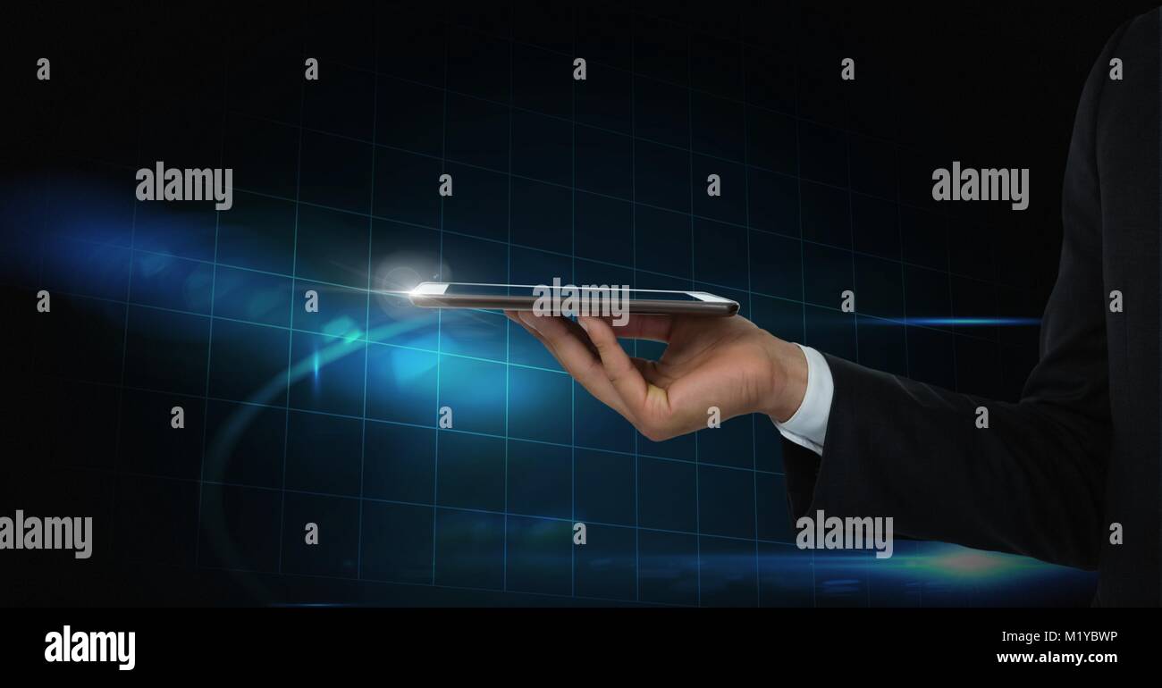 Hand holding tablet with blue technology background Stock Photo - Alamy