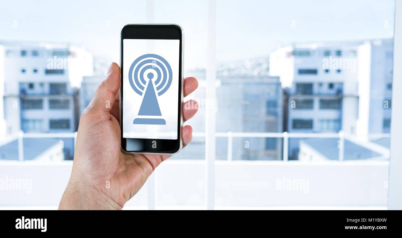Hand holding phone with signal icon Stock Photo - Alamy