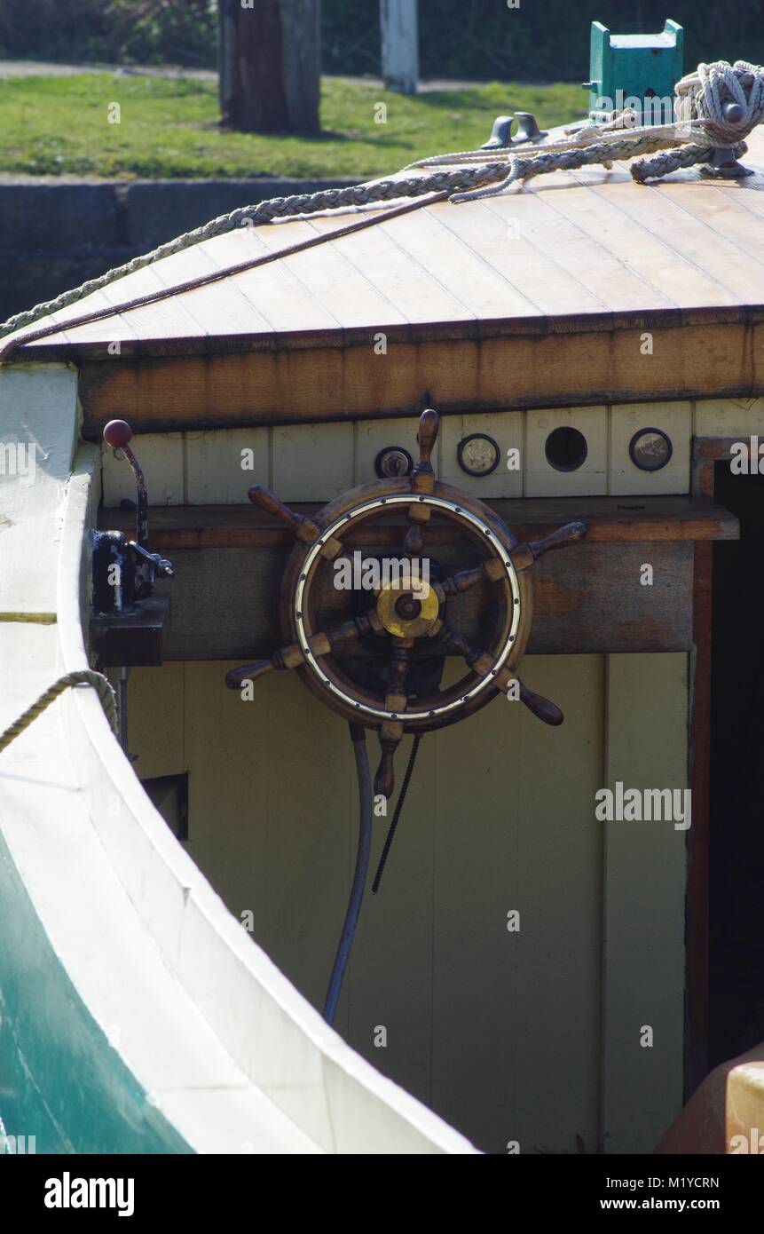 Helm and Ship's Wheel of the Bow of a Classic Wooden Boat Moored on the ...