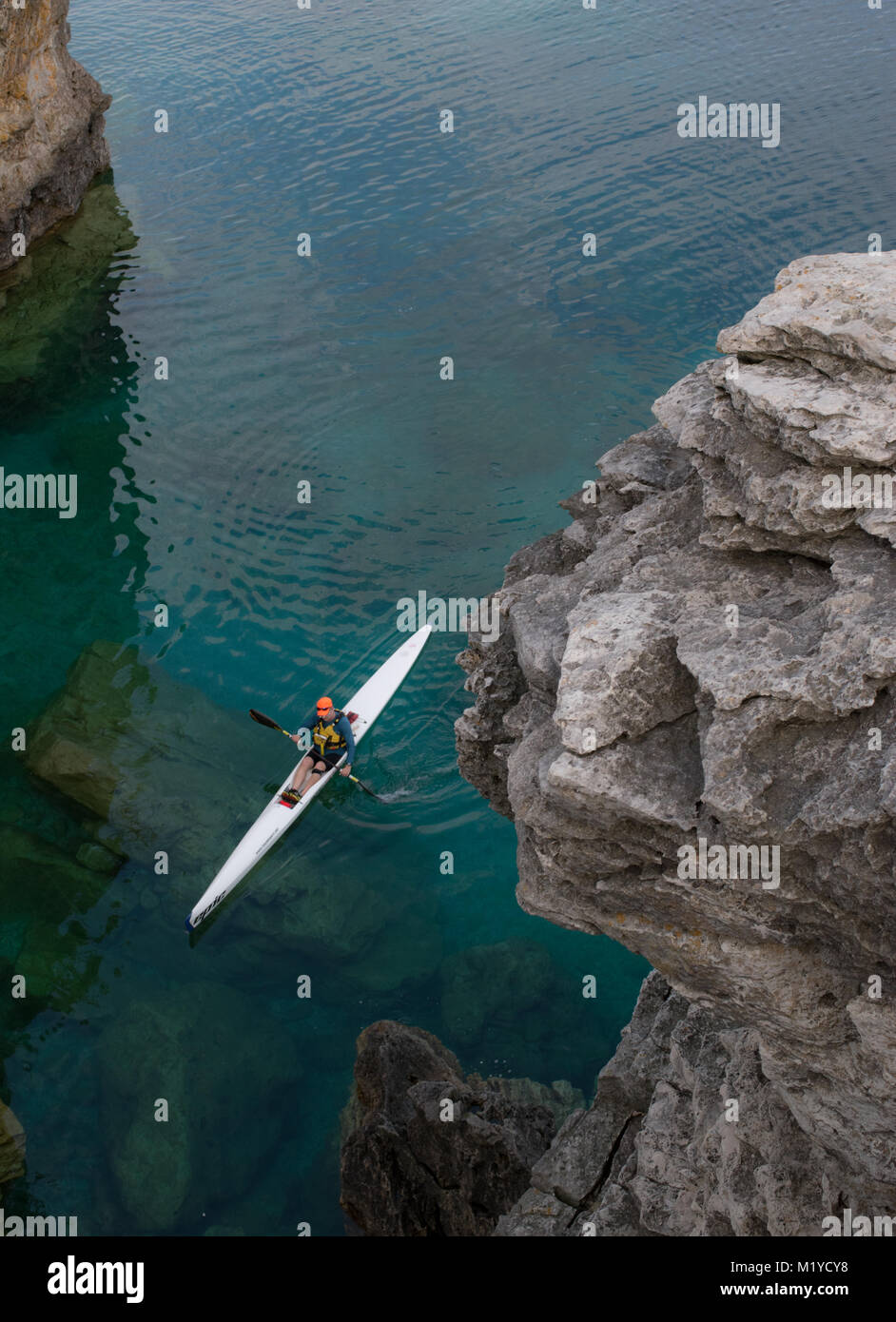 male in kayak near cliffs Stock Photo - Alamy