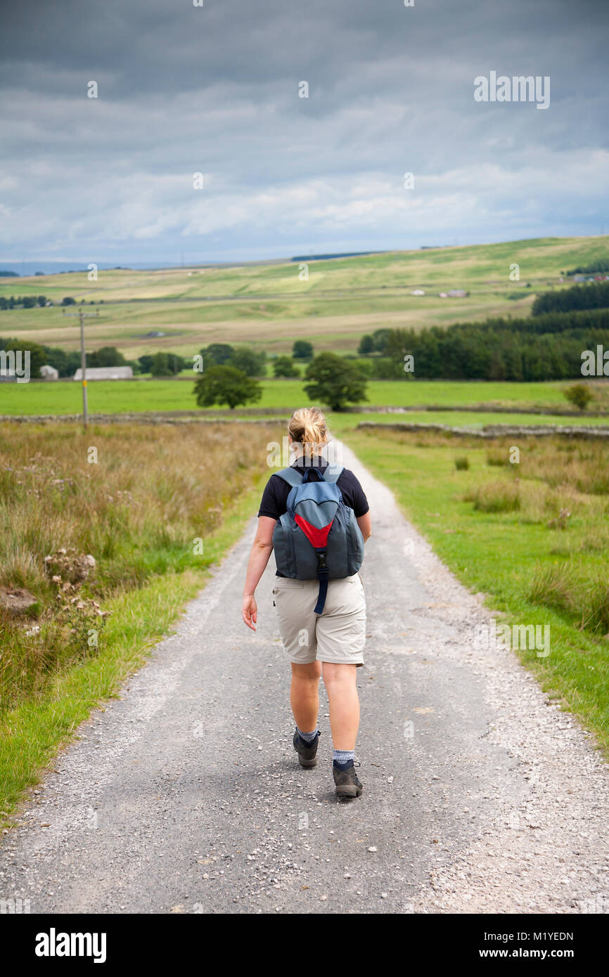 Woman country lane walking hi-res stock photography and images - Alamy