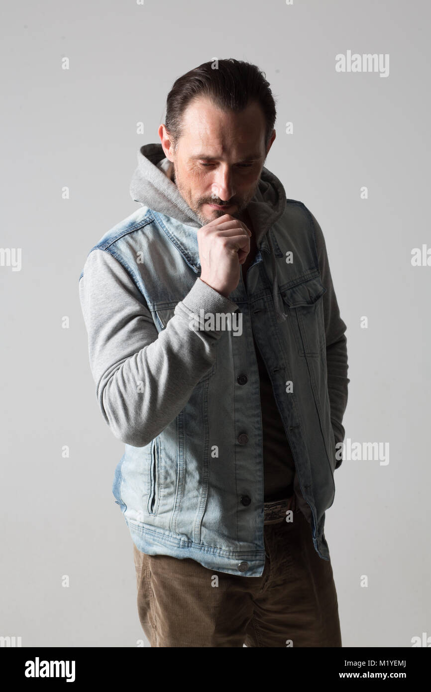 Pretty young man posing Stock Photo - Alamy