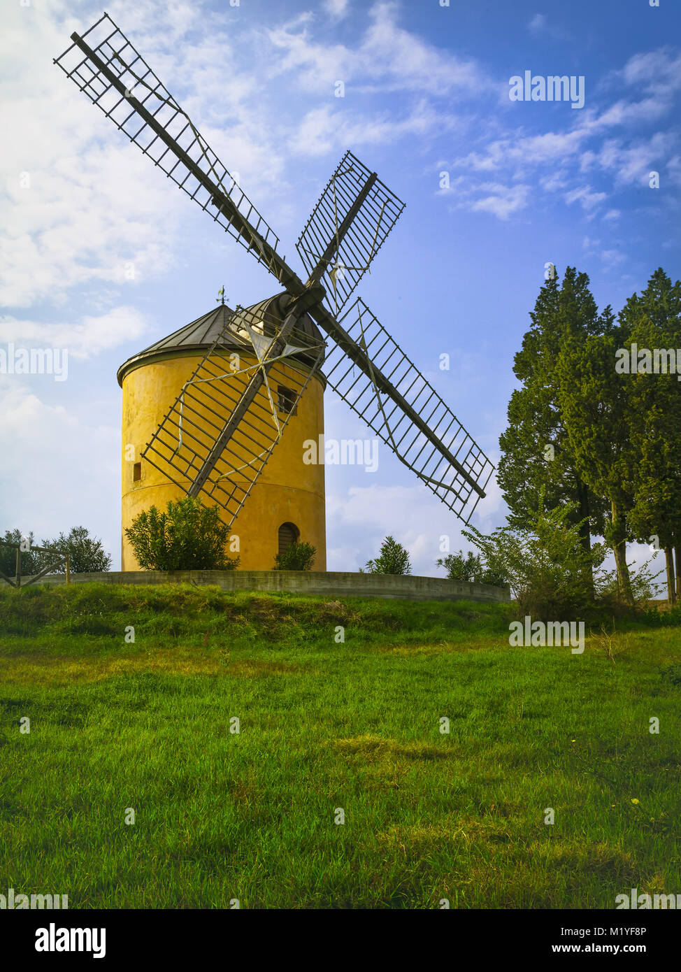 Yellow stone windmill in the Florentine countryside, Florence, Italy ...
