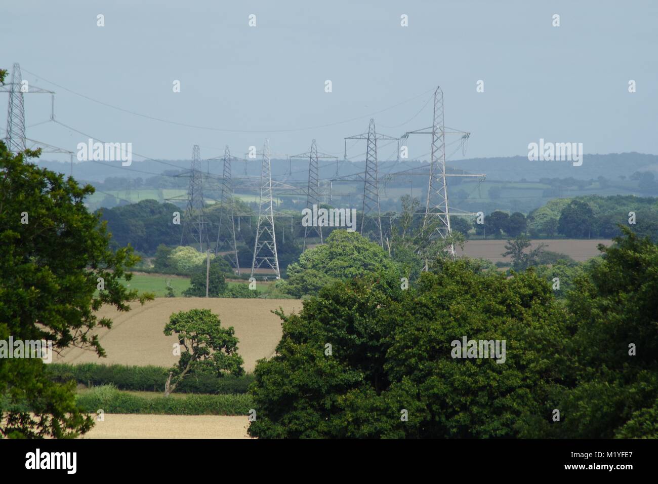 Electricity Pylons of the National Grid. Devon Farmland Landscape in ...