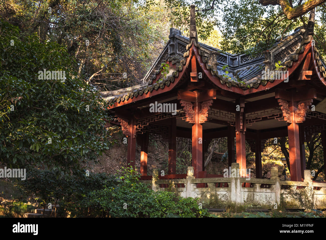 Traditional Chinese wooden gazebo pavilion on the coast of West Lake ...