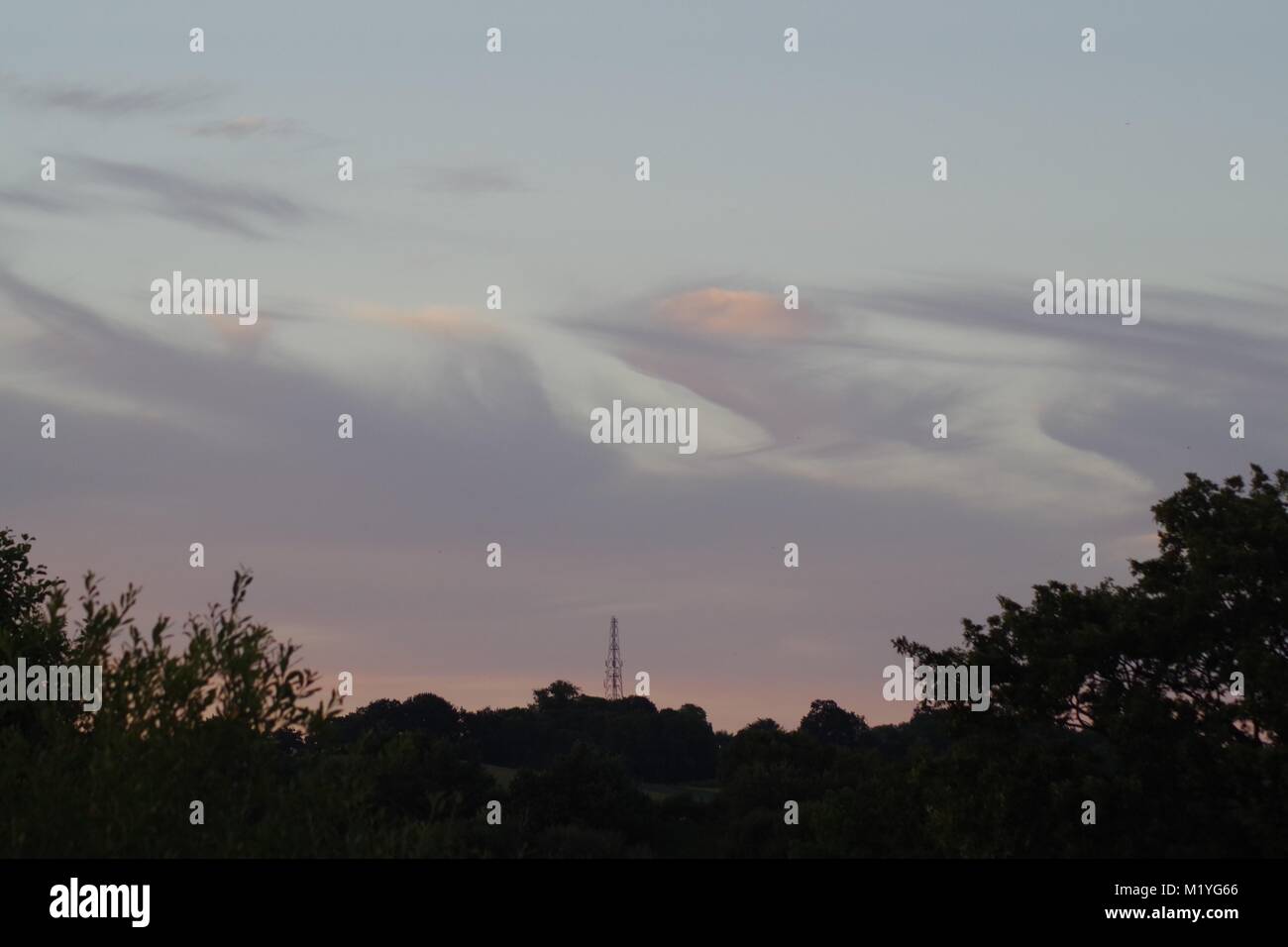 Subtle Sunset with Interesting Clouds and a Silhouetted Hedge Row on a ...