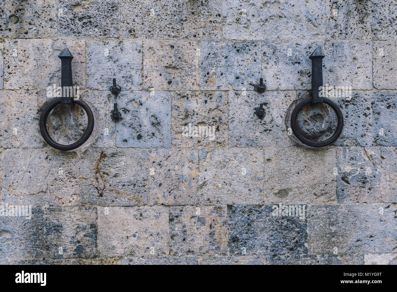 Ancient Iron ring to tie horses on stone wall, Siena Tuscany Italy ...