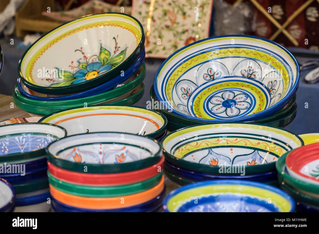 hand-painted dishes of a multitude of colors in a traditional art ...