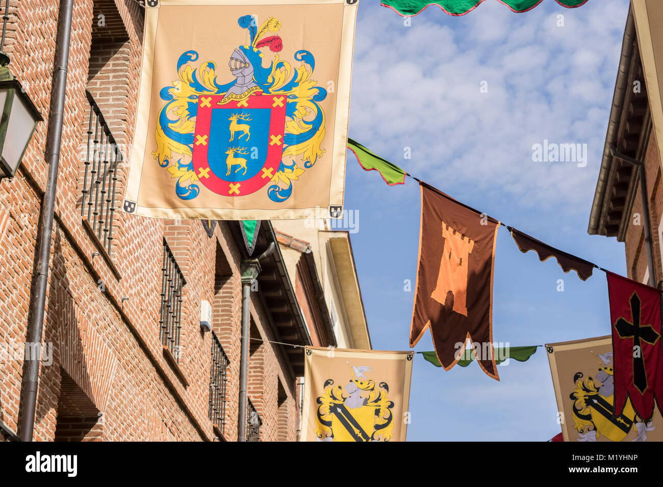 Flags, traditional medieval festival in the streets of Alcala de ...