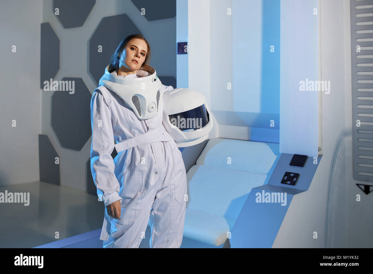 Portrait of a woman astronaut in a space suit, dreamy look up Stock ...