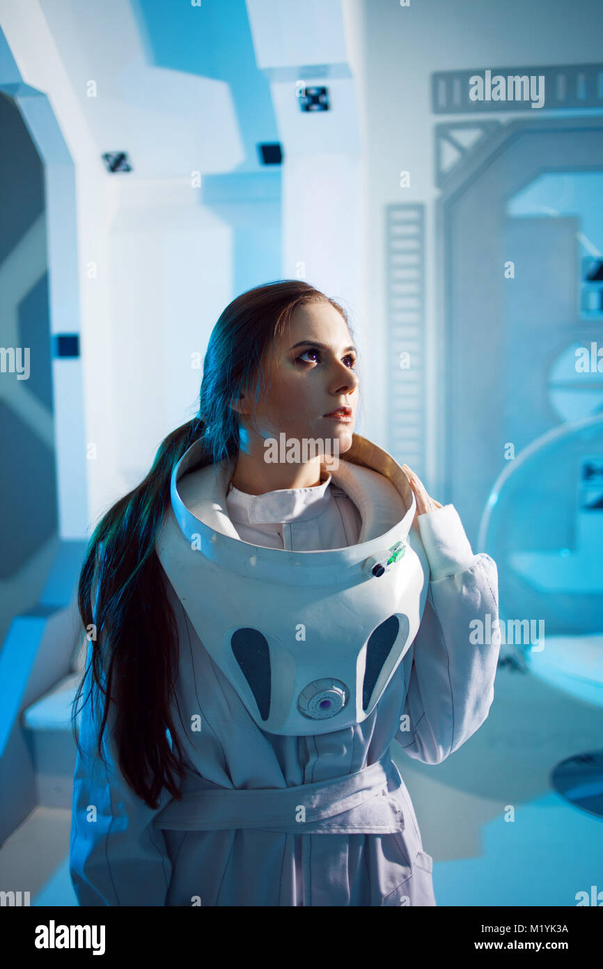 Portrait of a woman astronaut in a space suit, dreamy look up Stock ...