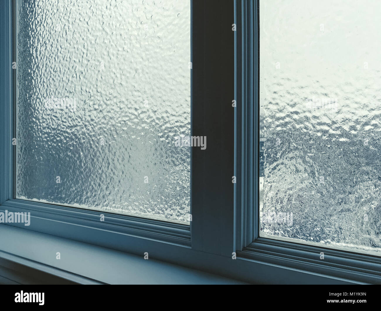 Light coming through the window frosted after the freezing rain Stock ...