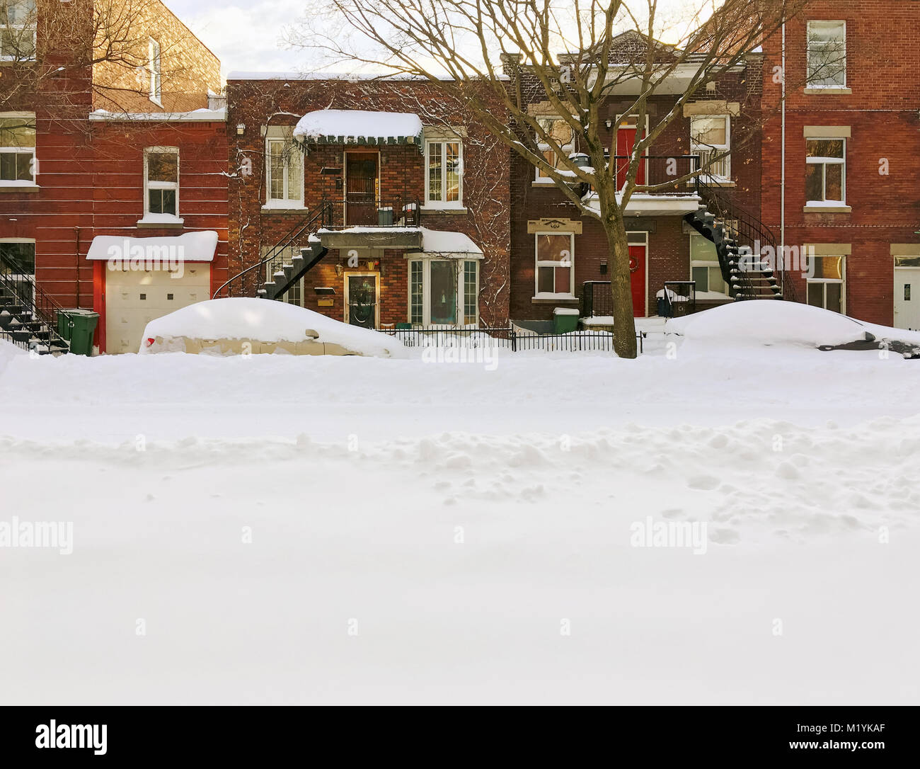 Snowy urban street with brick buildings. Space for text. Montreal ...