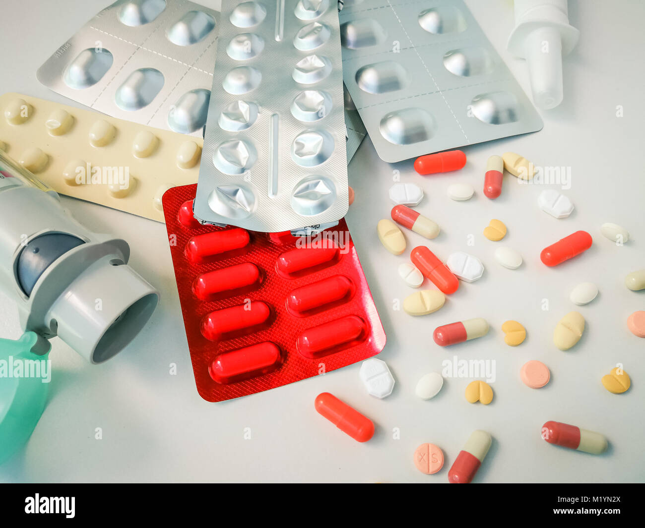 Medication white and colorful tablets arranged abstract on white color ...