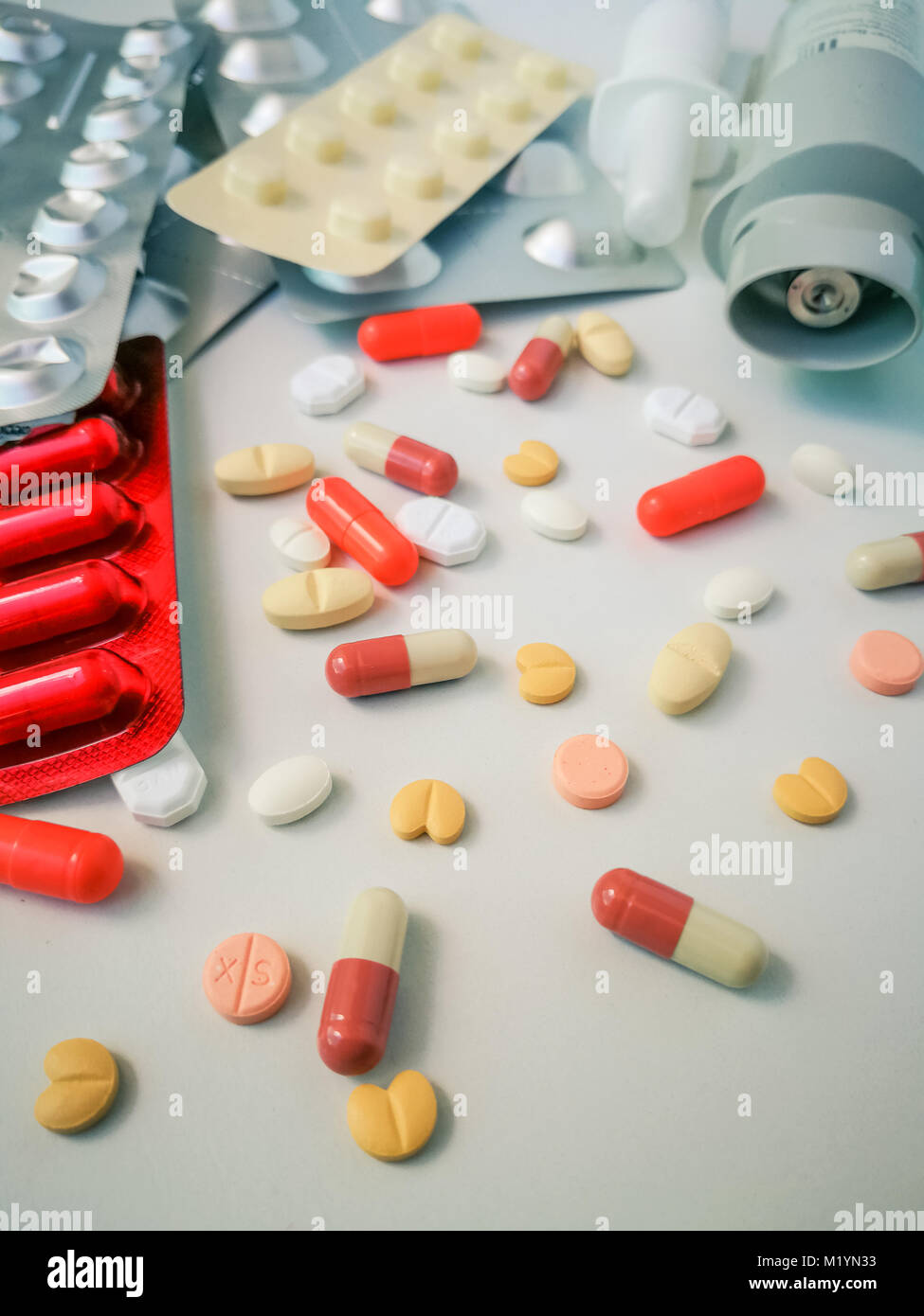 Medication white and colorful tablets arranged abstract on white color ...