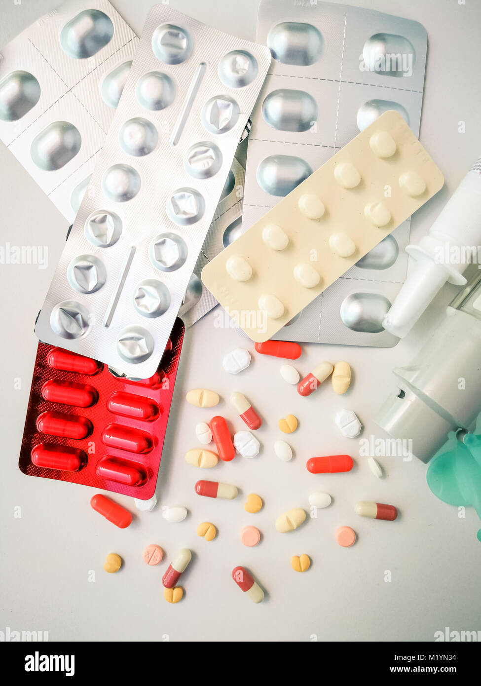 Medication white and colorful tablets arranged abstract on white color ...