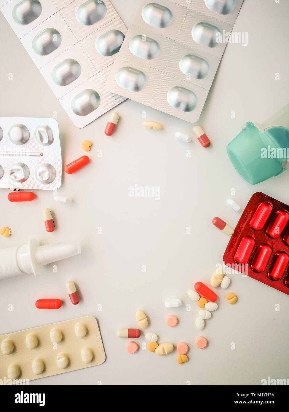 Medication white and colorful tablets arranged abstract on white color ...