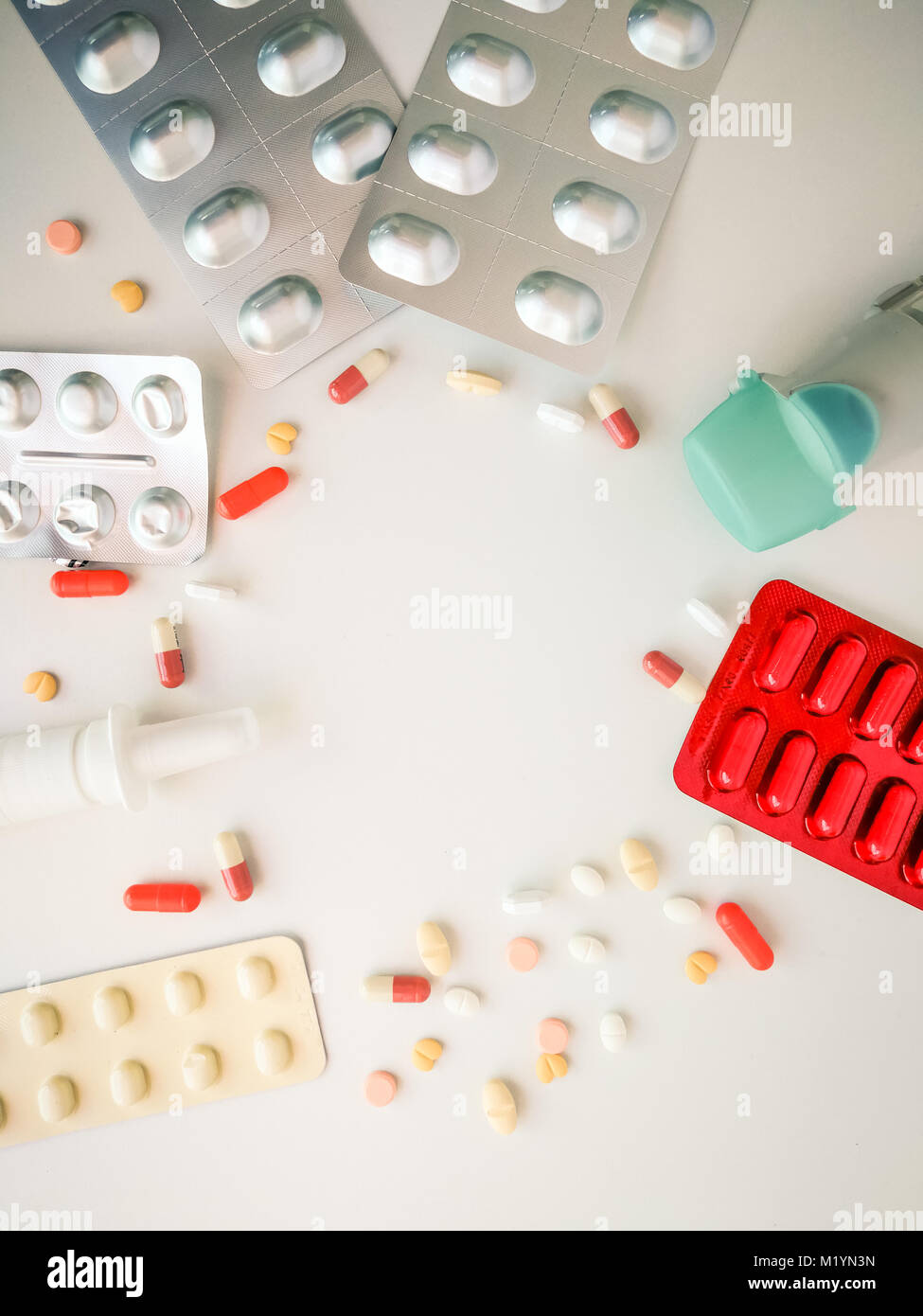 Medication white and colorful tablets arranged abstract on white color ...