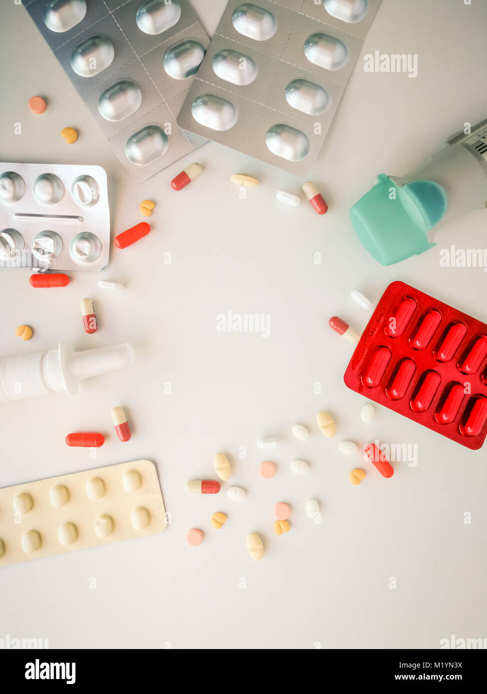 Medication white and colorful tablets arranged abstract on white color ...