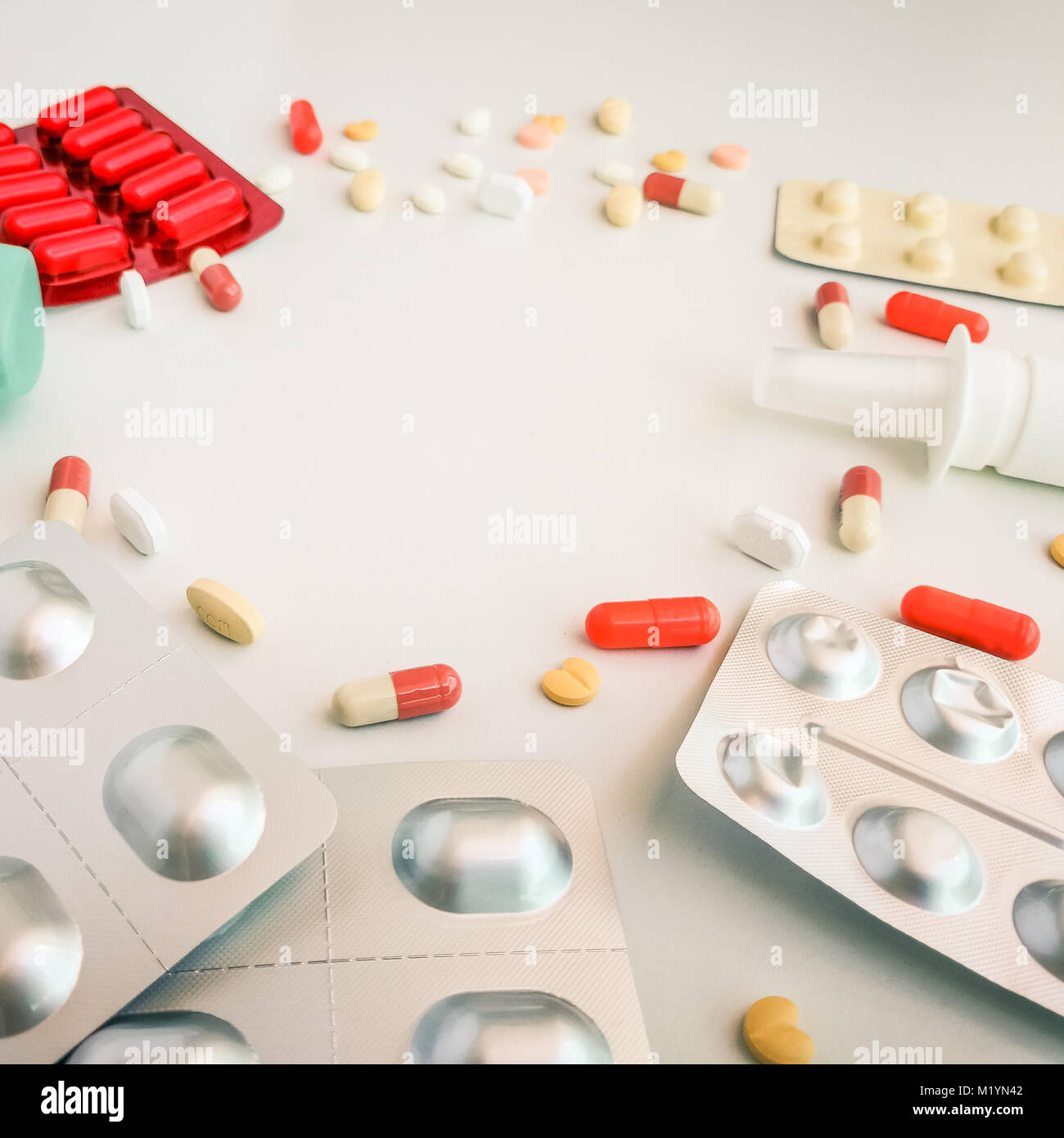 Medication white and colorful tablets arranged abstract on white color ...