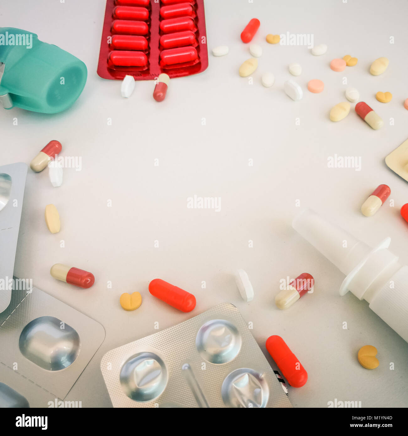 Medication white and colorful tablets arranged abstract on white color ...
