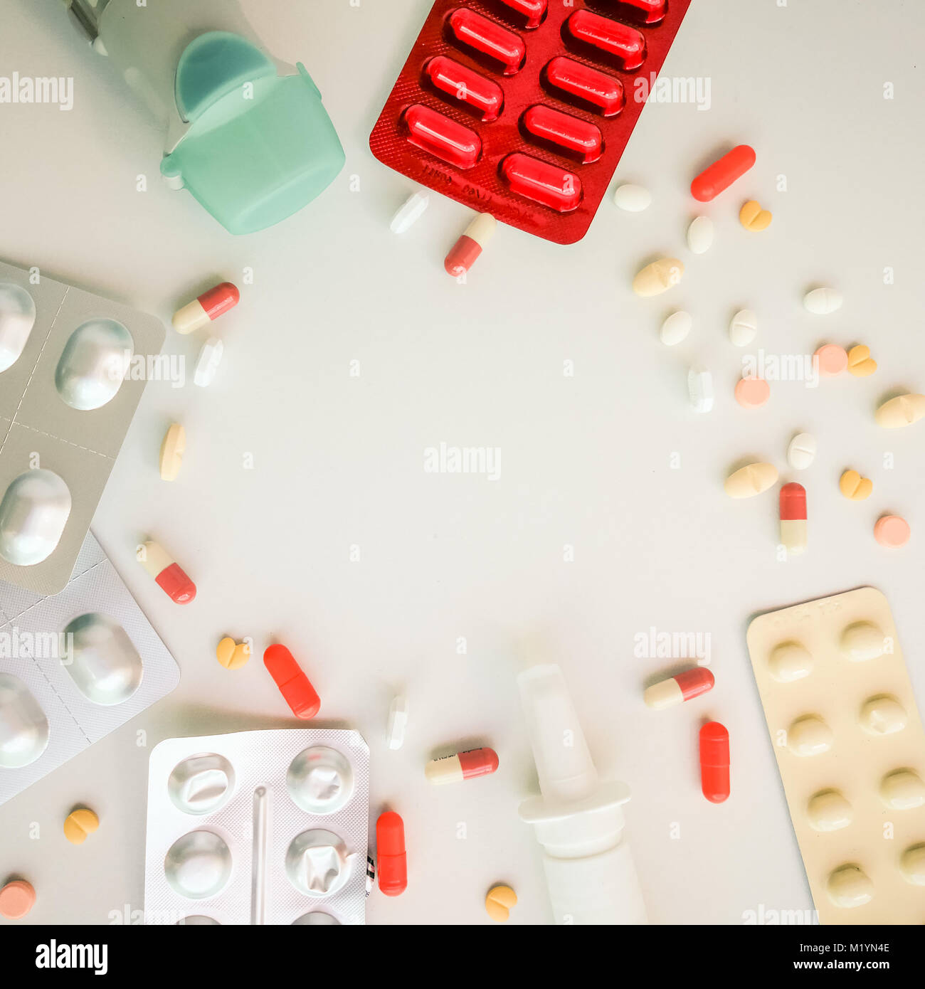 Medication white and colorful tablets arranged abstract on white color ...