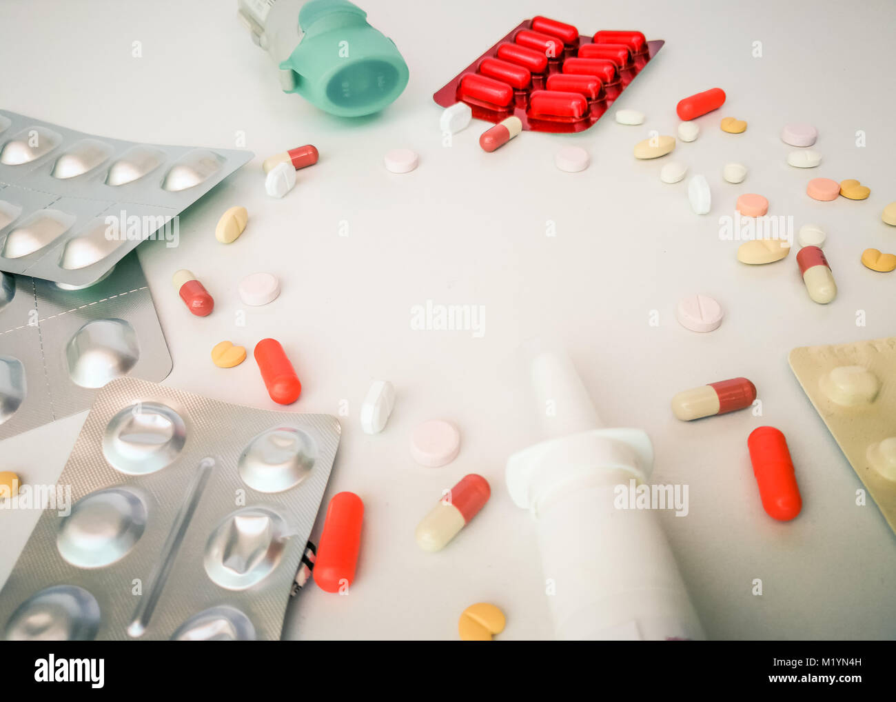 Medication white and colorful tablets arranged abstract on white color ...
