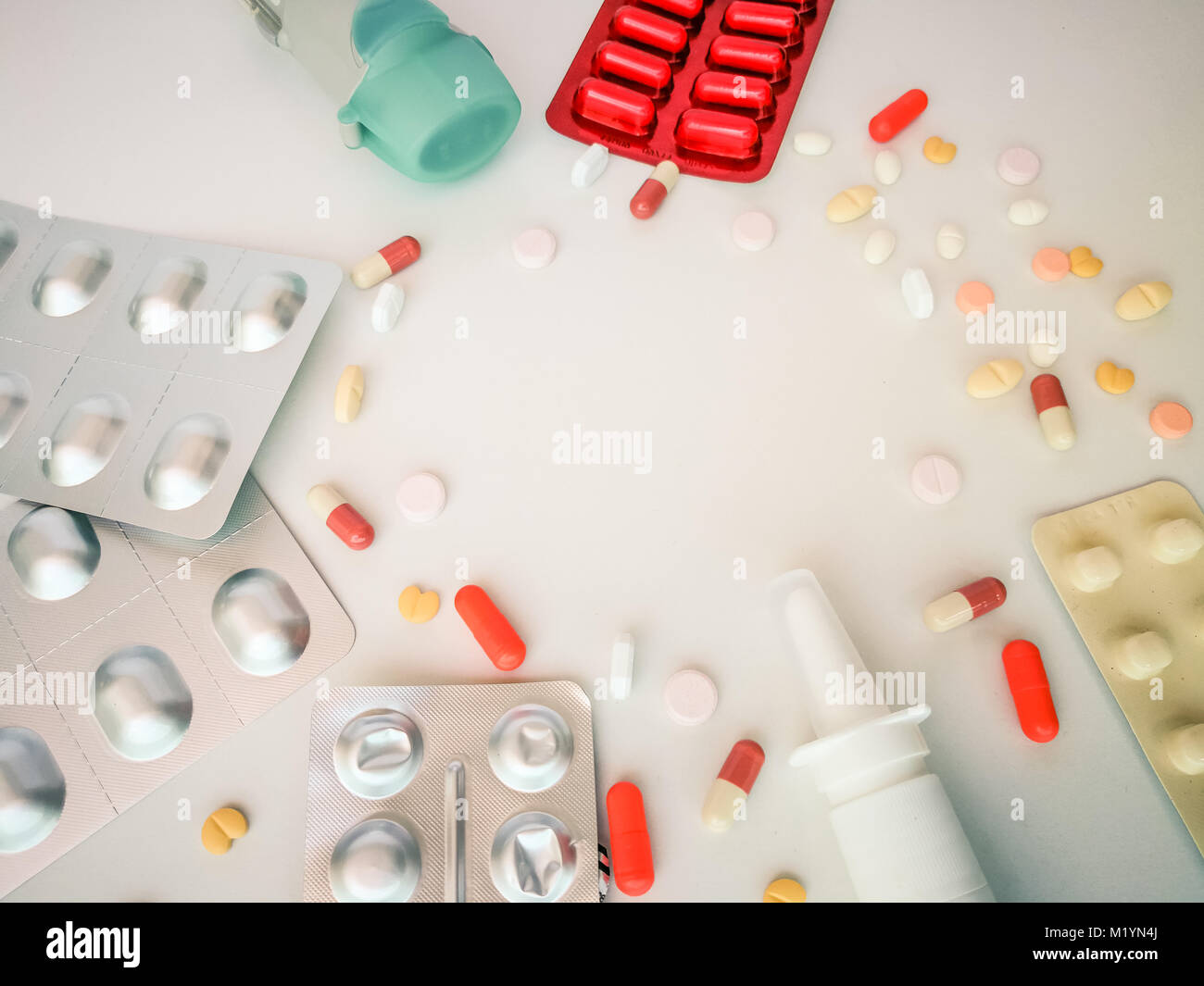 Medication white and colorful tablets arranged abstract on white color ...