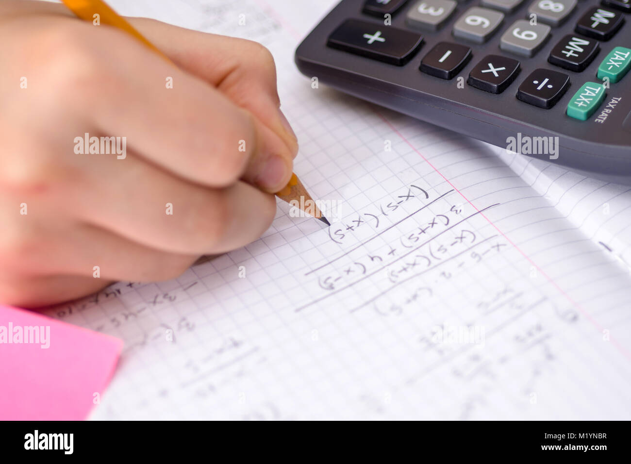 Writing in Notebook Close Up. Pencil in Children Hand Stock Photo - Alamy