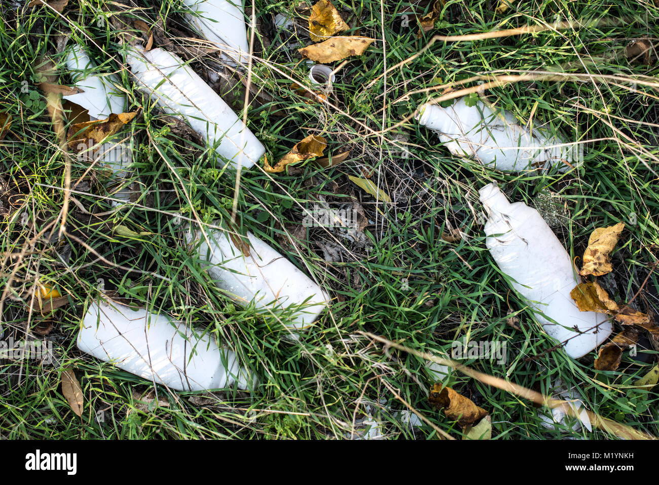 Many white plastic waste on grass. Industrial waste Stock Photo - Alamy