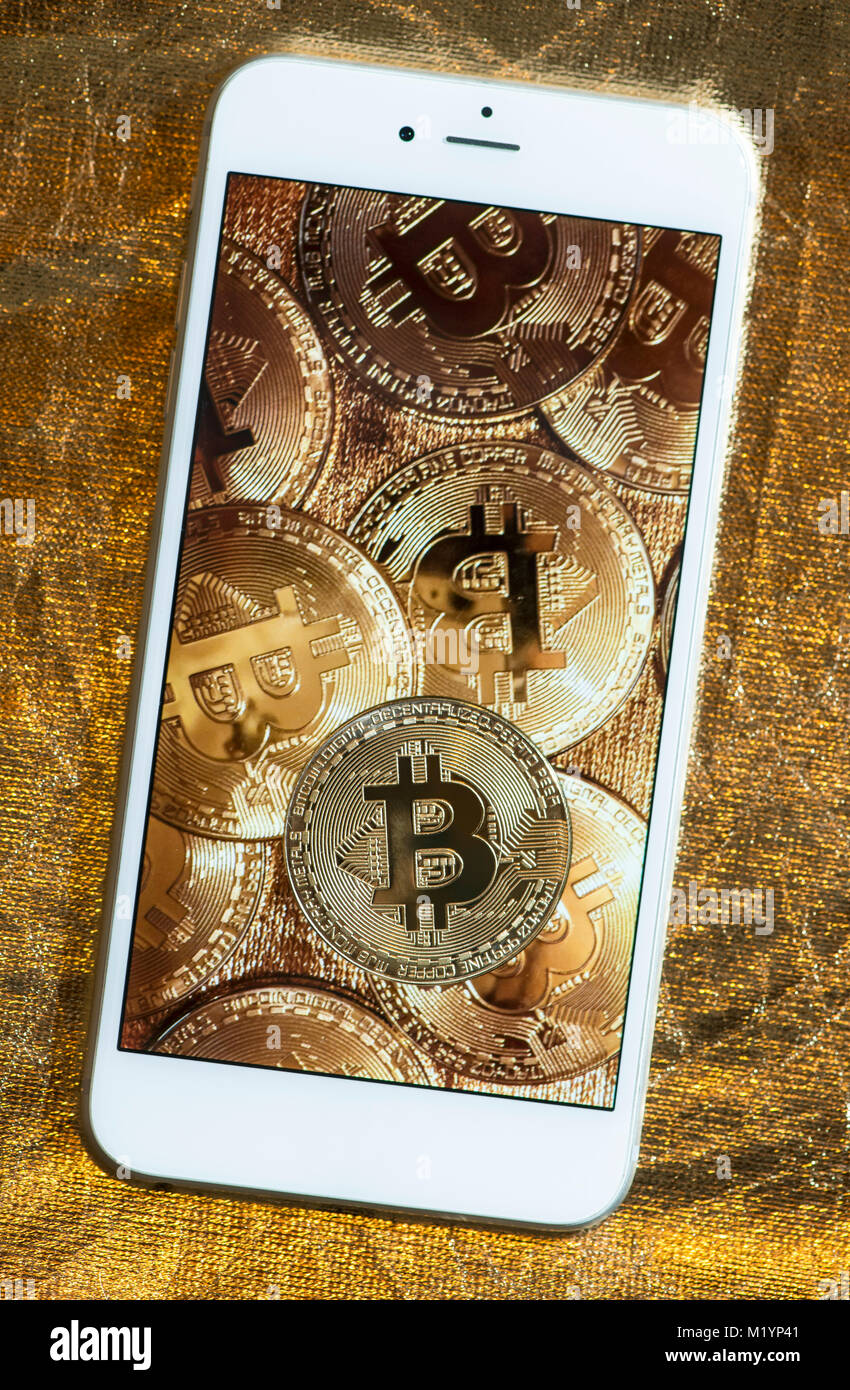 Bitcoin and smartphone on gold background Stock Photo - Alamy