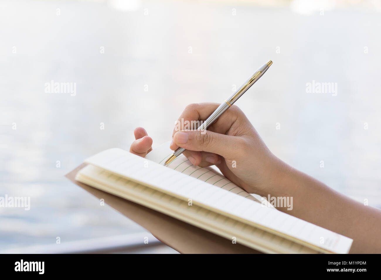 Writing dairy on notebook on chair, concept as memory of life and ...