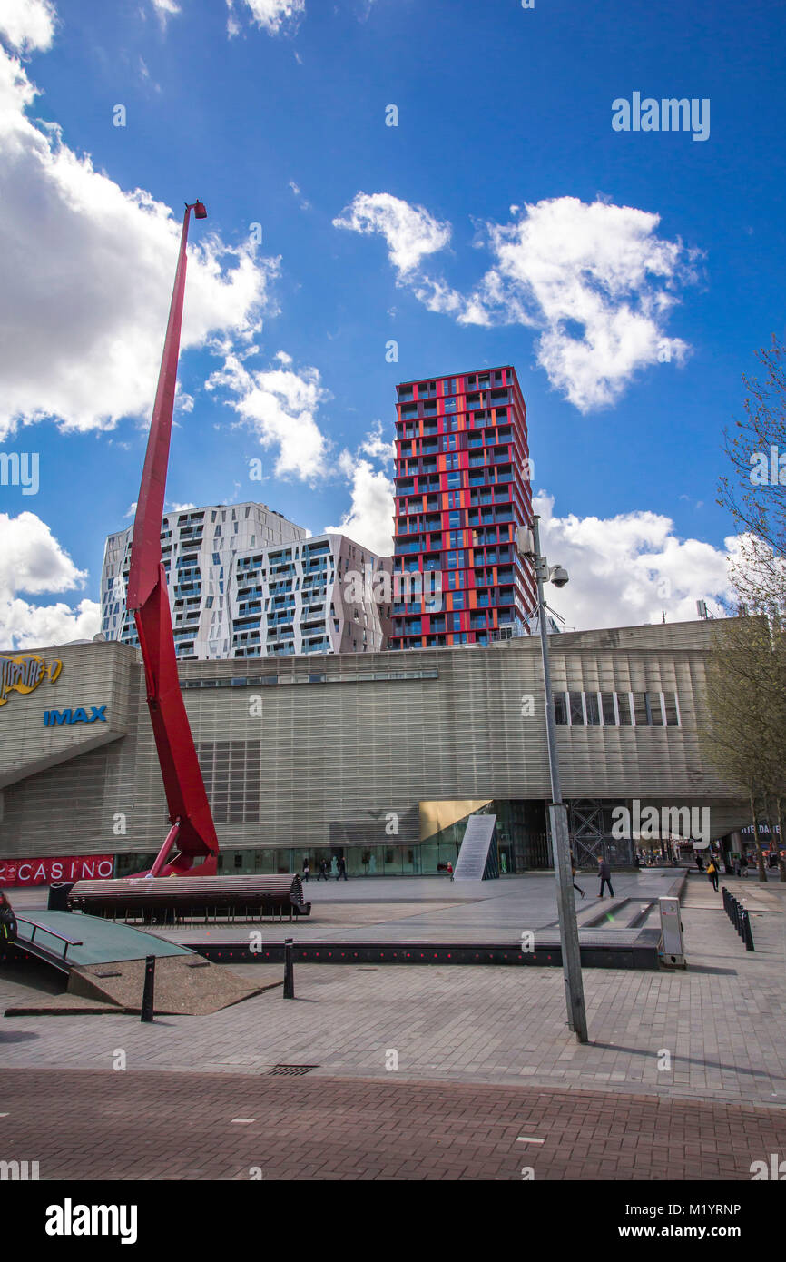 Rotterdam on a sunny day, shopping mall surrounded by big red statues ...