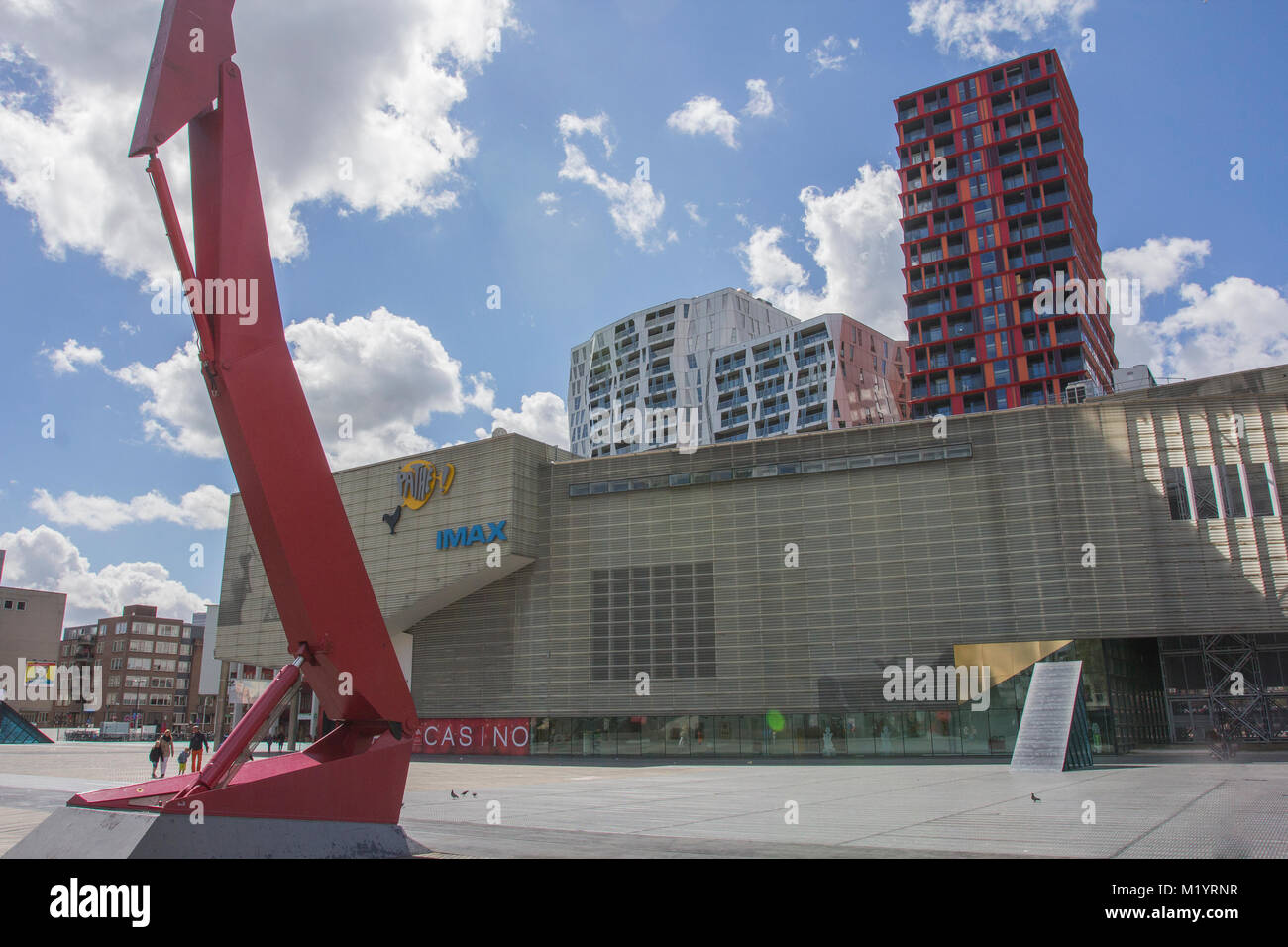 Rotterdam on a sunny day, shopping mall surrounded by big red statues ...