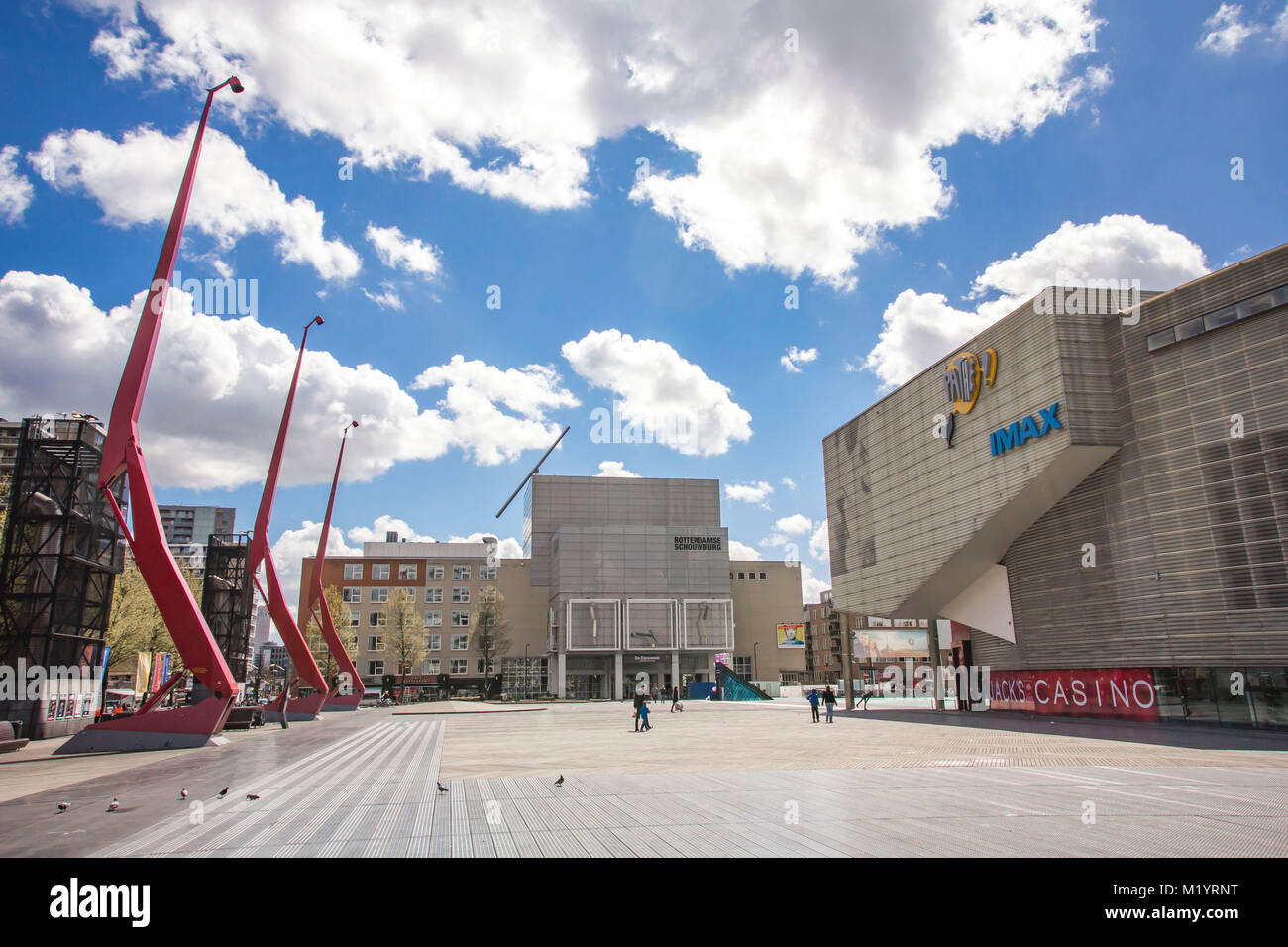 Rotterdam on a sunny day, shopping mall surrounded by big red statues ...