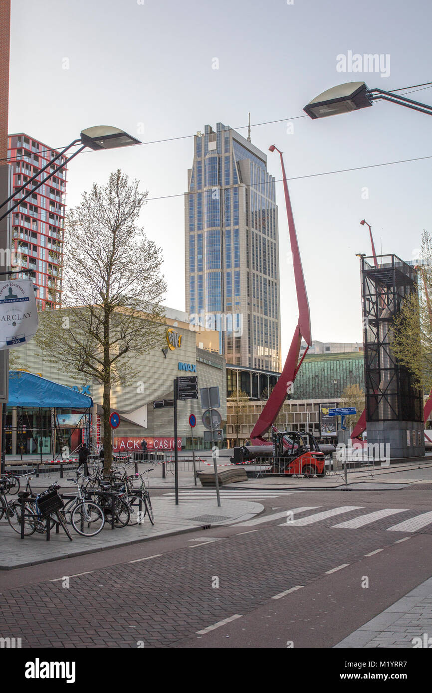 Rotterdam on a sunny day, shopping mall surrounded by big red statues ...