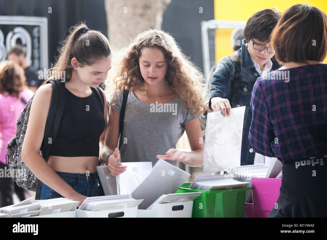 LONDON, ENGLAND - AUGUST 22, 2017 Young girls at second hand book stall ...