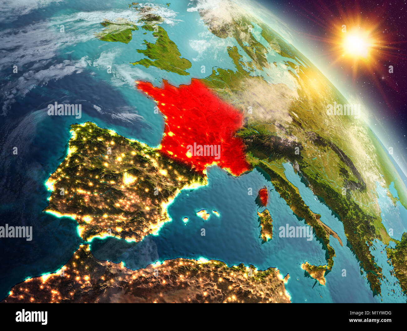 Sunrise above France highlighted in red on model of planet Earth in ...