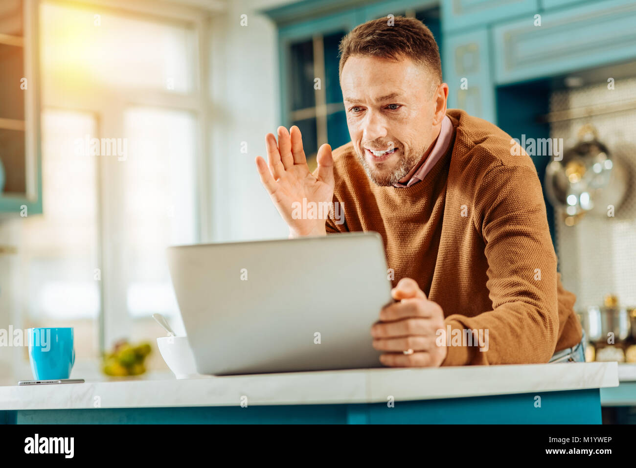 Positive nice man greeting his friend Stock Photo - Alamy Positive nice man greeting his friend Stock Photo - Alamy