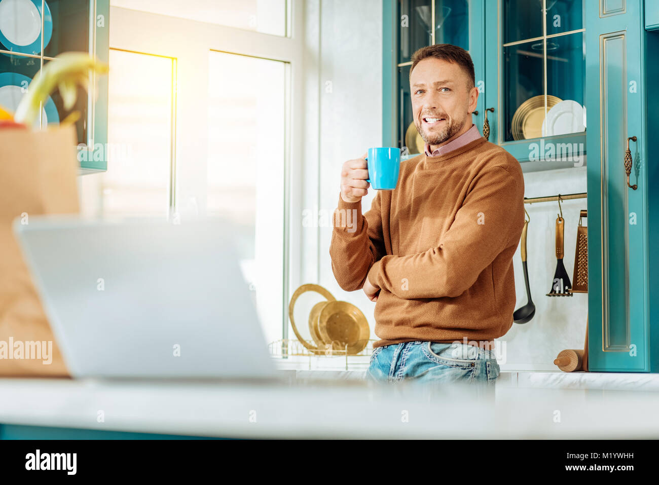 Nice positive man drinking hi-res stock photography and images - Alamy